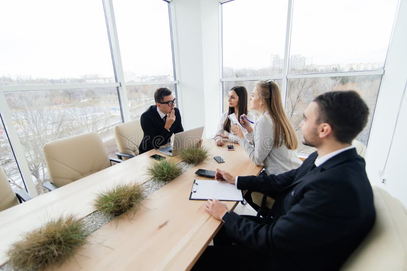 Team Leader Discussing with Workers in Conference Room Stock Photo ...