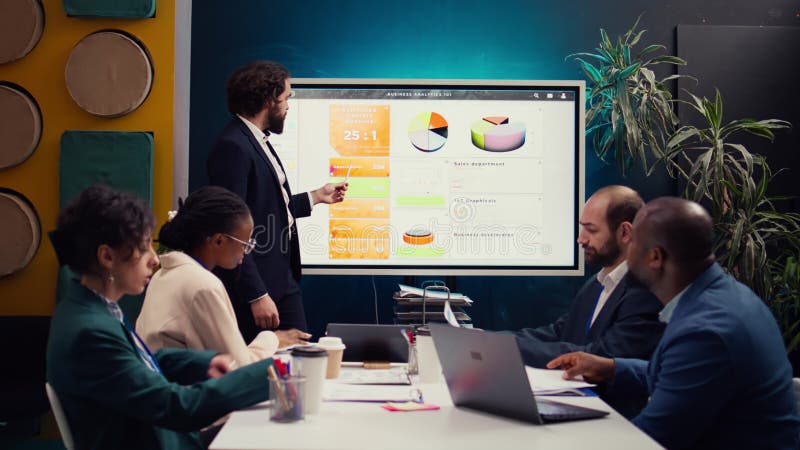 Team Leader Showing Infographics Data on Interactive Board Stock ...