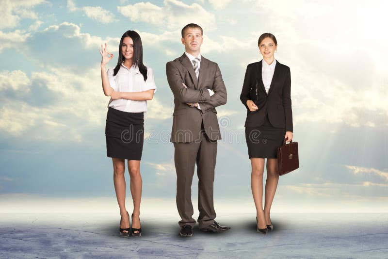 Team Leader Stands with Coworkers in Background Stock Photo - Image of ...
