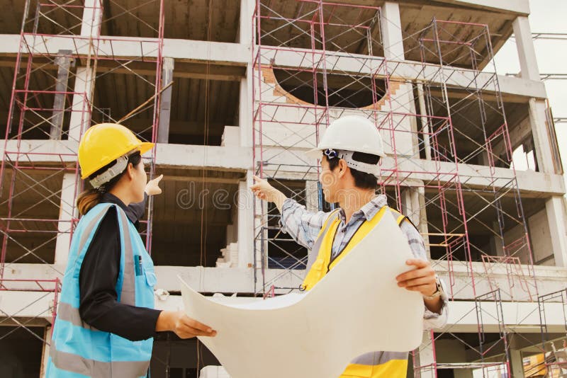 Team of Male Architect Engineers and Female Project Contractors Stand ... Team of Male Architect Engineers and Female Project Contractors Stand ...