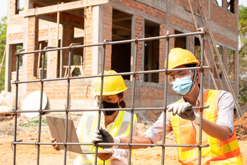 A Team of Male and Female Engineers or Architects is Exploring and ...