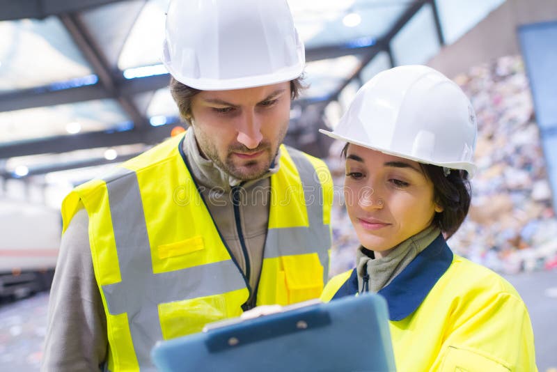 Team Manager and Technician Discussing Recycling Issues Stock Photo ...
