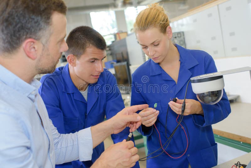 Team Mechanical Engineers with Cables Stock Photo - Image of physics ...