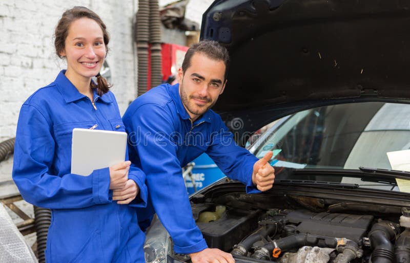 Team of Mechanics Working at the Garage Stock Image - Image of repair ...