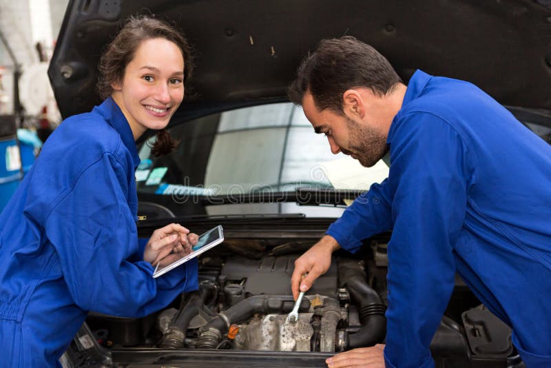 Team of Mechanics Working at the Garage Stock Photo - Image of industry ...