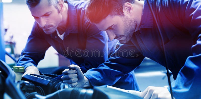 Team of Mechanics Working Together Stock Image - Image of serious ...