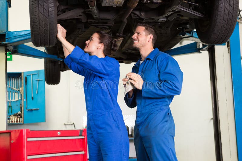 Team of Mechanics Working Together Stock Photo - Image of caucasian ...