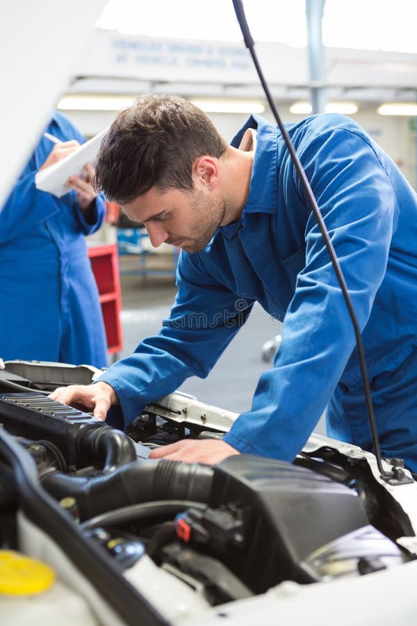 Team of Mechanics Working Together Stock Photo - Image of adult ...