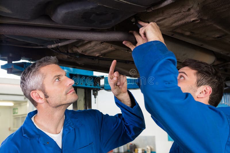 Team of Mechanics Working Together Stock Image - Image of machinist ...