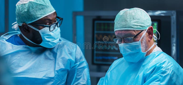 Team of Medical Doctors Performs Surgical Operation in Modern Operating ...