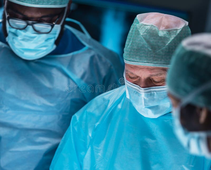 Team of Medical Doctors Performs Surgical Operation in Modern Operating ...
