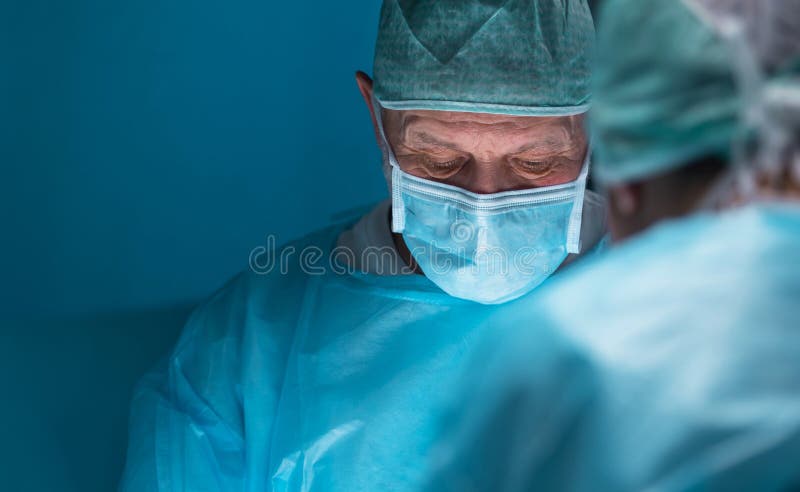 Team of Medical Doctors Performs Surgical Operation in Modern Operating ...