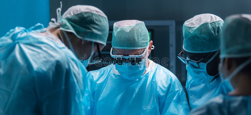 Team of Medical Doctors Performs Surgical Operation in Modern Operating ...