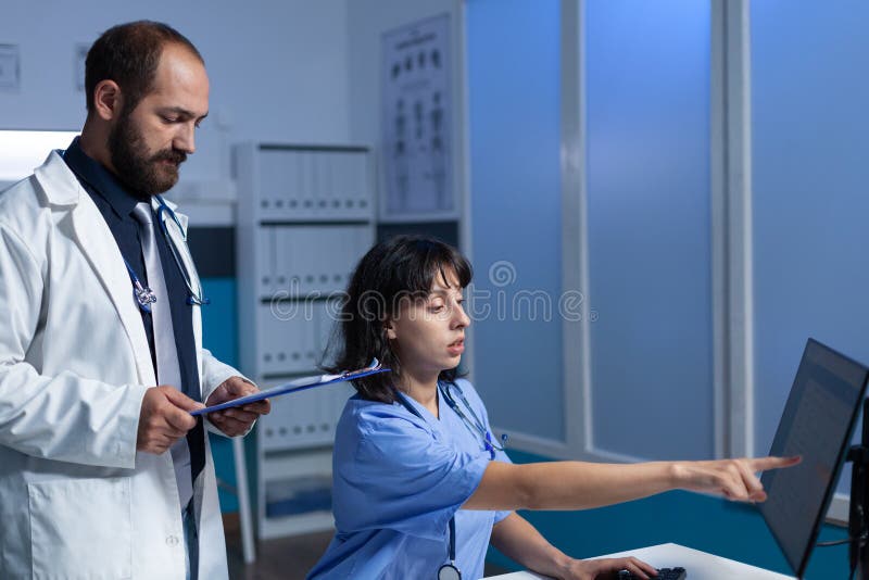 Team of Medical Specialists Working with Computer Screen Stock Photo ...