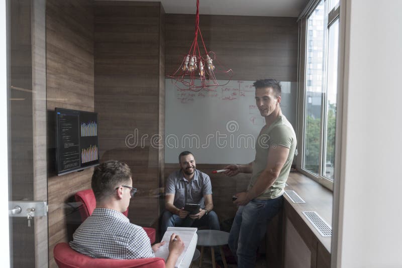 Team Meeting and Brainstorming in Small Private Office Stock Photo ...