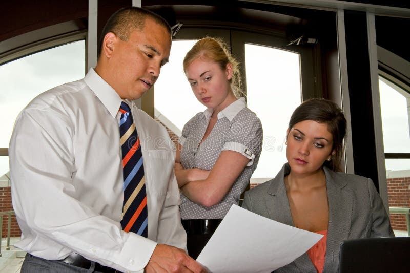 Team Meeting Reviewing a Report Stock Photo - Image of ethnic ...