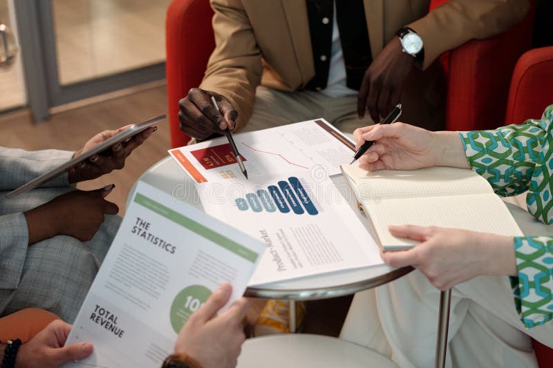 Team Members Analyzing Data and Statistics Together Stock Image - Image ...