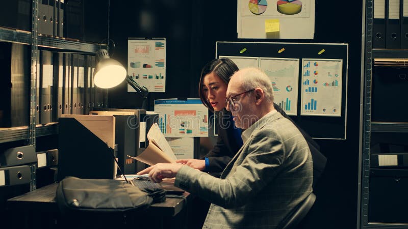 Team Members Cross Reference Data To Track Down Potential Suspect Stock ...