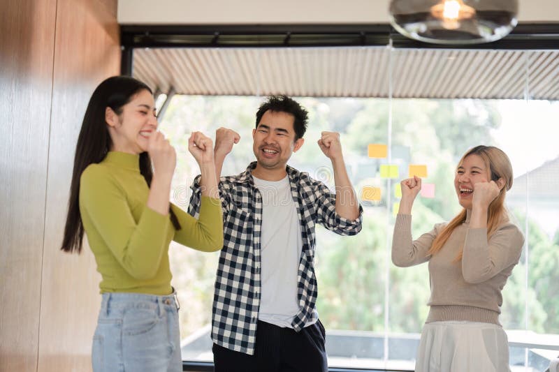 Team Members Expressing Joy and Collaboration in a Modern Office ...