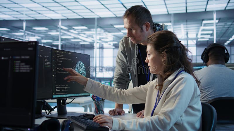 It Team Members Programming Scripts on Computer, Employing AI Machine Learning Stock Photo ...