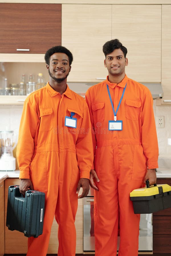 Team of Multi-ethnic Plumbers Stock Image - Image of adult, standing ...