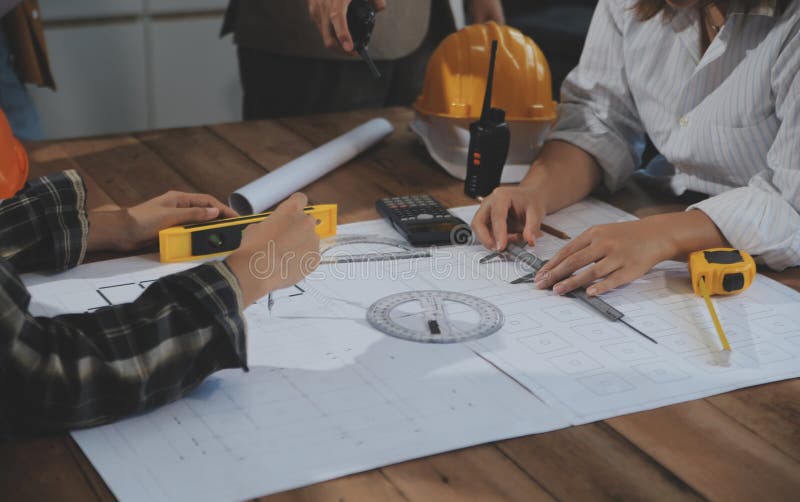 Team of Multiethnic Architects Working on Construction Plans in Meeting ...