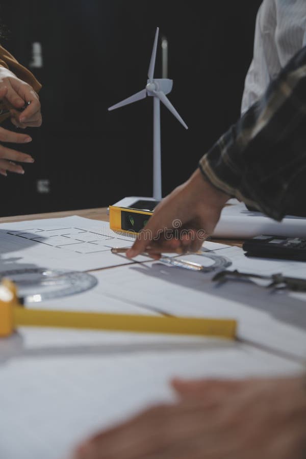 Team of Multiethnic Architects Working on Construction Plans in Meeting ...