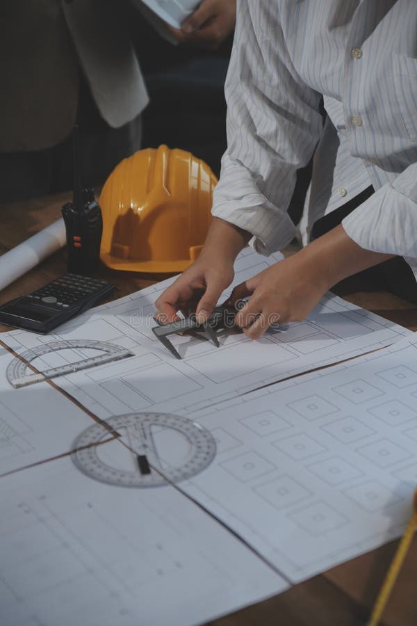 Team of Multiethnic Architects Working on Construction Plans in Meeting ...