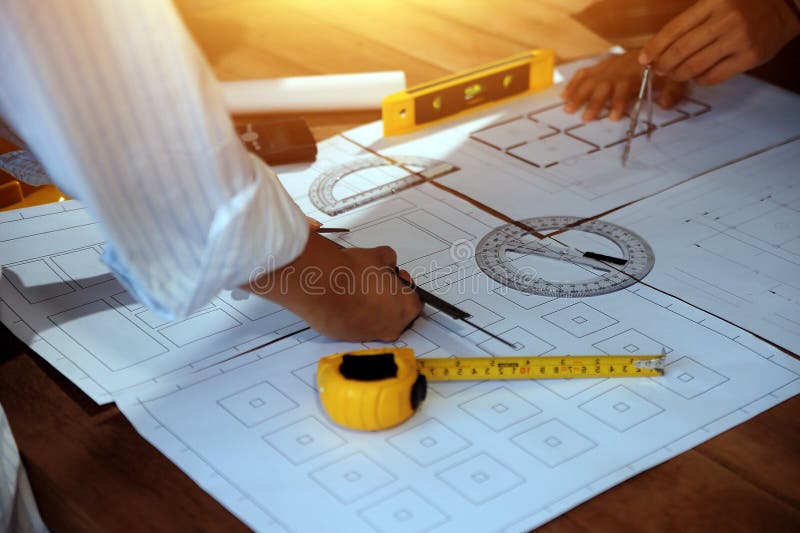 Team of Multiethnic Architects Working on Construction Plans in Meeting ...