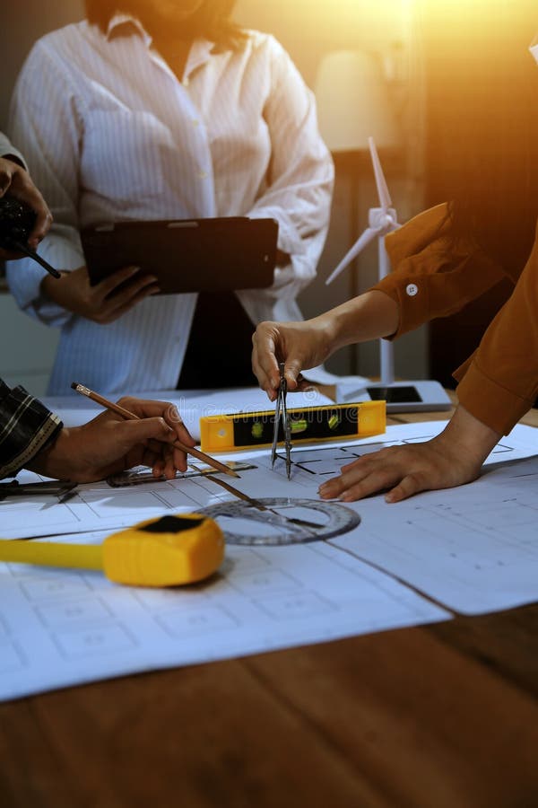 Team of Multiethnic Architects Working on Construction Plans in Meeting ...