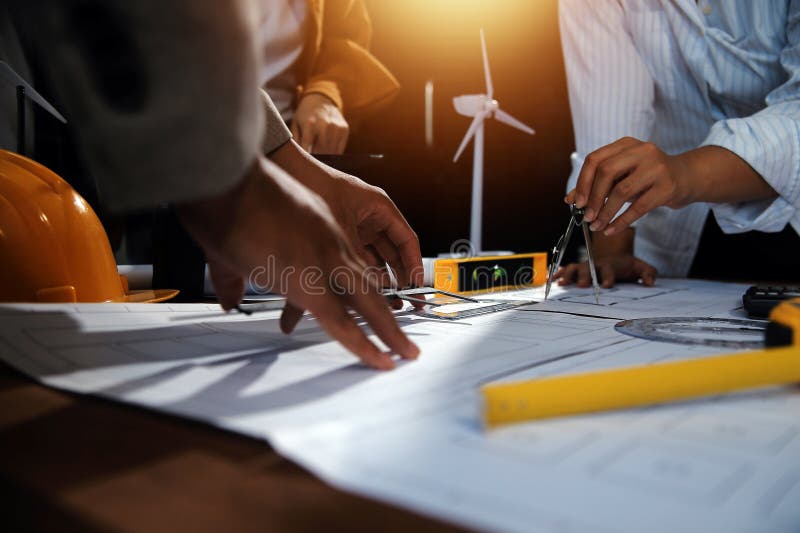 Team of Multiethnic Architects Working on Construction Plans in Meeting ...