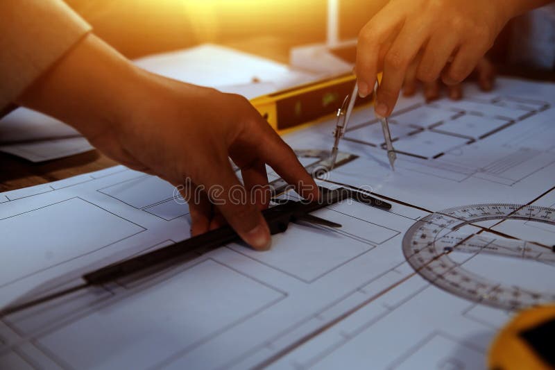 Team of Multiethnic Architects Working on Construction Plans in Meeting ...