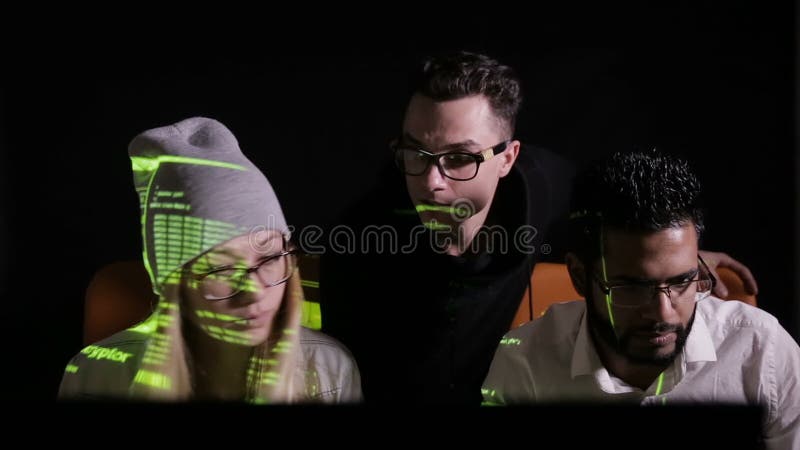 Team of Multiethnic it Professionals Working with Computers in Dark ...