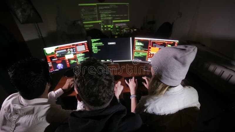 Team of Multiethnic it Professionals Working with Computers in Dark ...