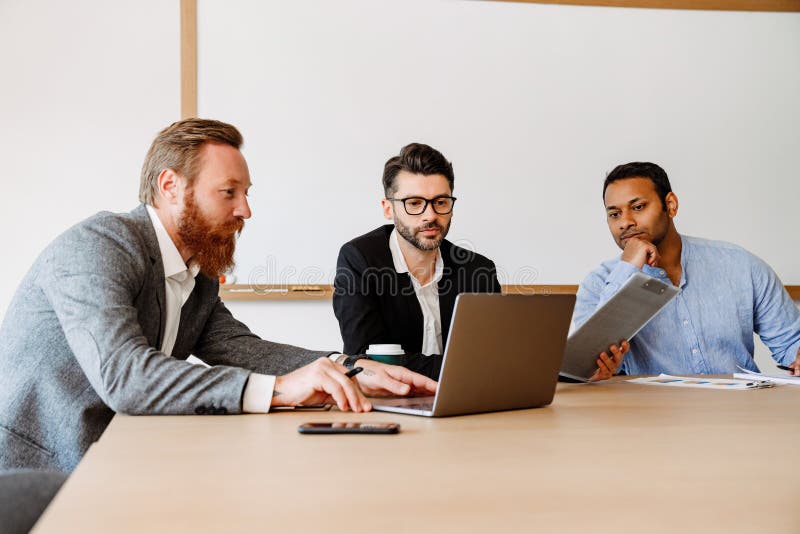 Three Multinational Women Working Together in Office Stock Image ...