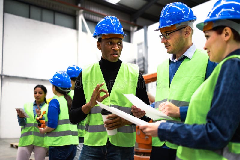 Team of Engineers Working in Robotic Factory Stock Photo - Image of ...