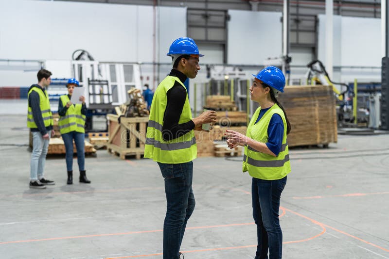 Team of Engineers Working in Robotic Factory Stock Photo - Image of ...