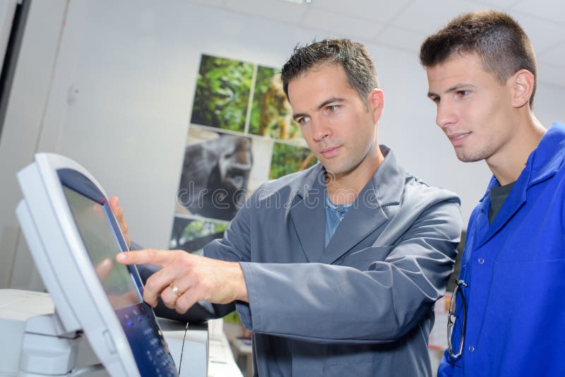 Team Operating Printing Machine Stock Image - Image of youth, marketing ...