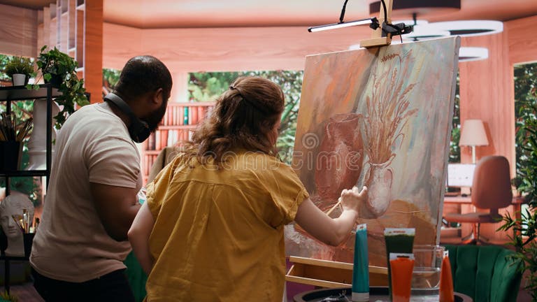 Team of Painters Collaborating on a Rustic Masterpiece in Art Studio ...