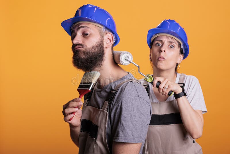 Team of Painters Using Paintbrush and Roller in Studio Stock Photo ...