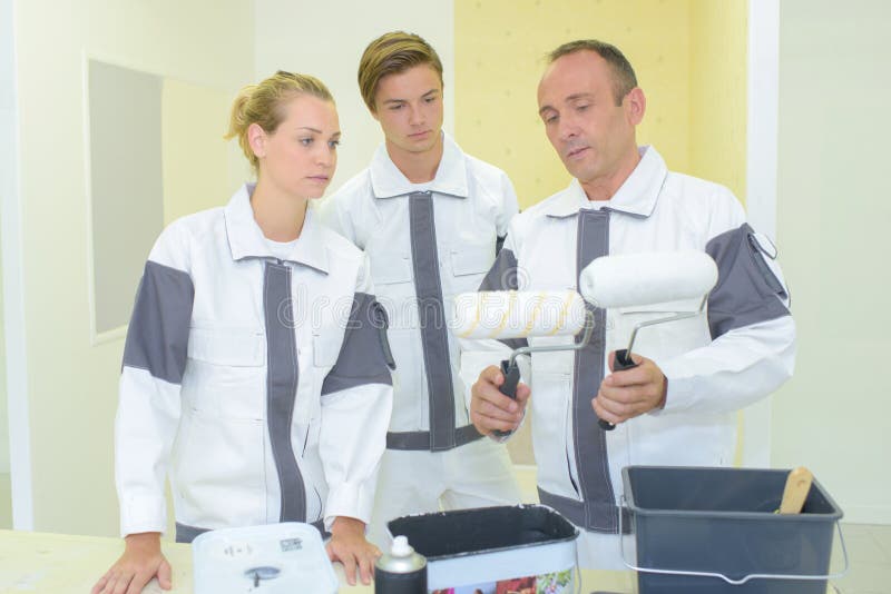 Team painters at work stock photo. Image of teacher - 214071404