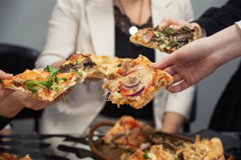 Team people eating pizza stock image. Image of pizza - 270679883