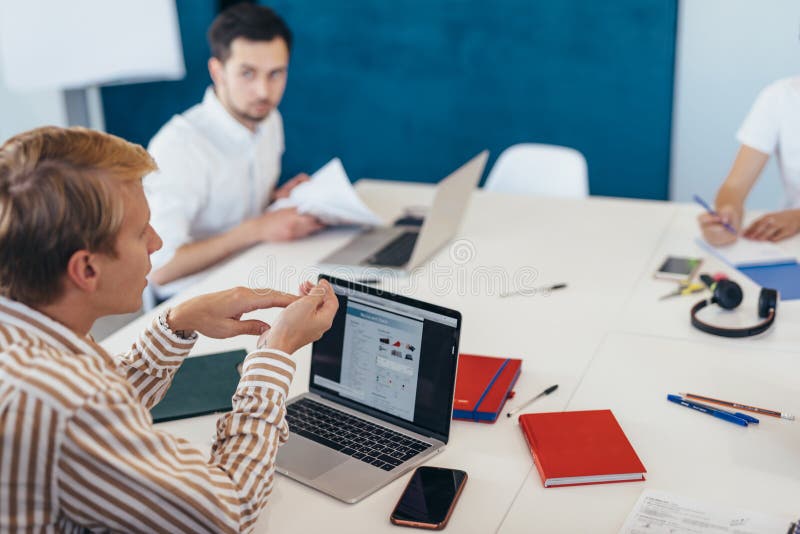 Team of People Gather at Work while Sitting at Conference Table Stock ...