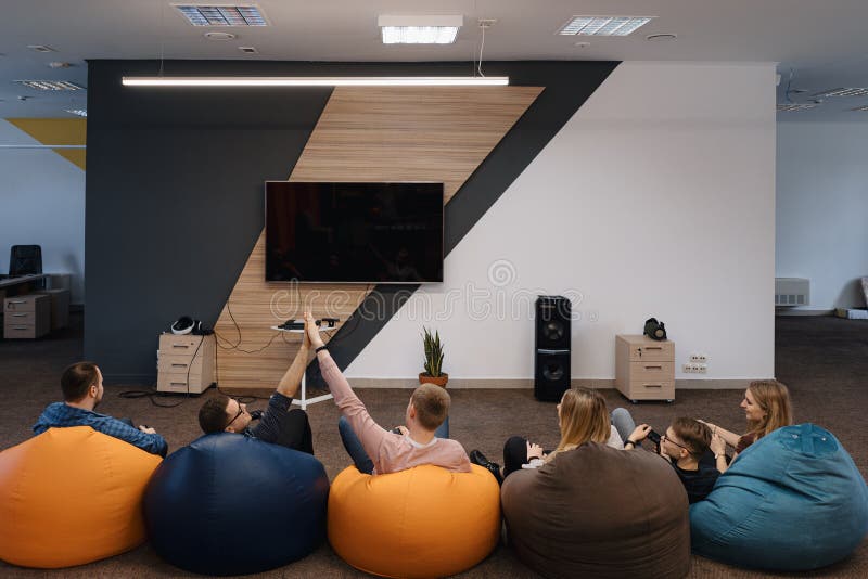 An it Team Play Video Games on the Console while Relaxing after Work ...