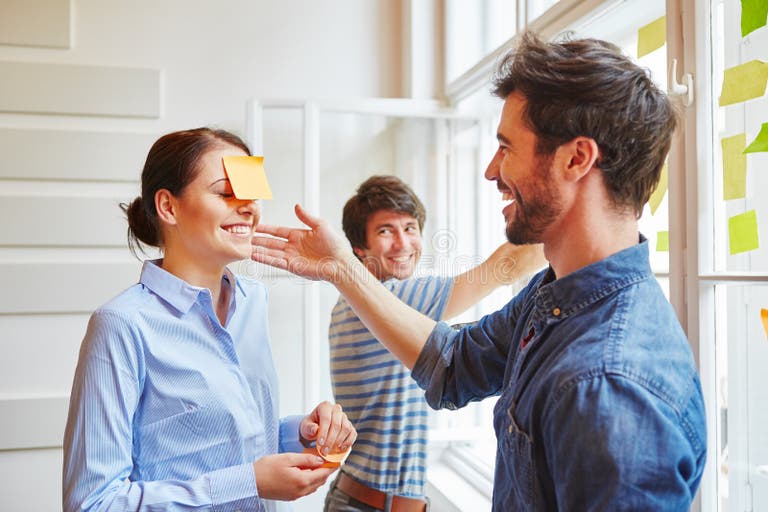 Team Plays Guessing Game for Team Building Stock Image - Image of note ...
