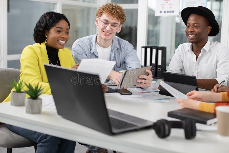 Creative Multiracial Design Professionals Planning Strategy at Table in ...