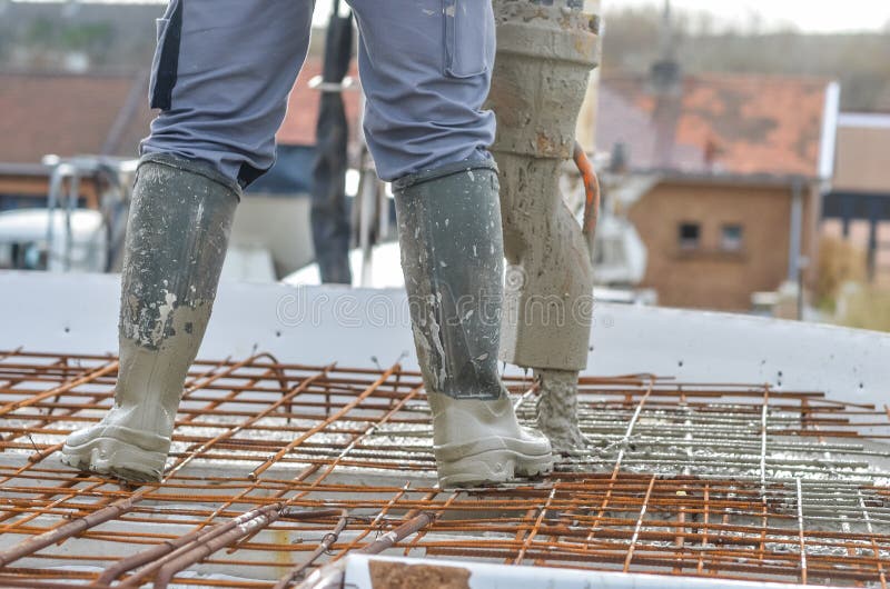 Team Pouring a Concrete Screed on a Construction Site of a Detached ...