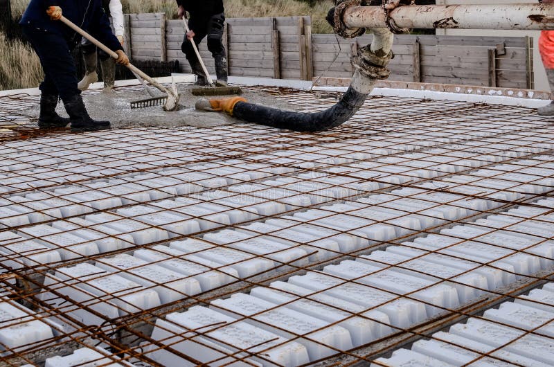Team Pouring a Concrete Screed on a Construction Site of a Detached ...