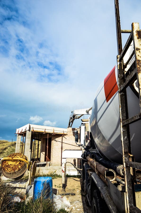 Team Pouring a Concrete Screed on a Construction Site of a Detached ...