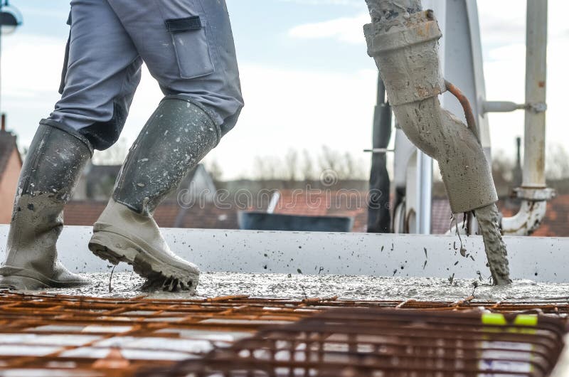 Team Pouring a Concrete Screed on a Construction Site of a Detached ...
